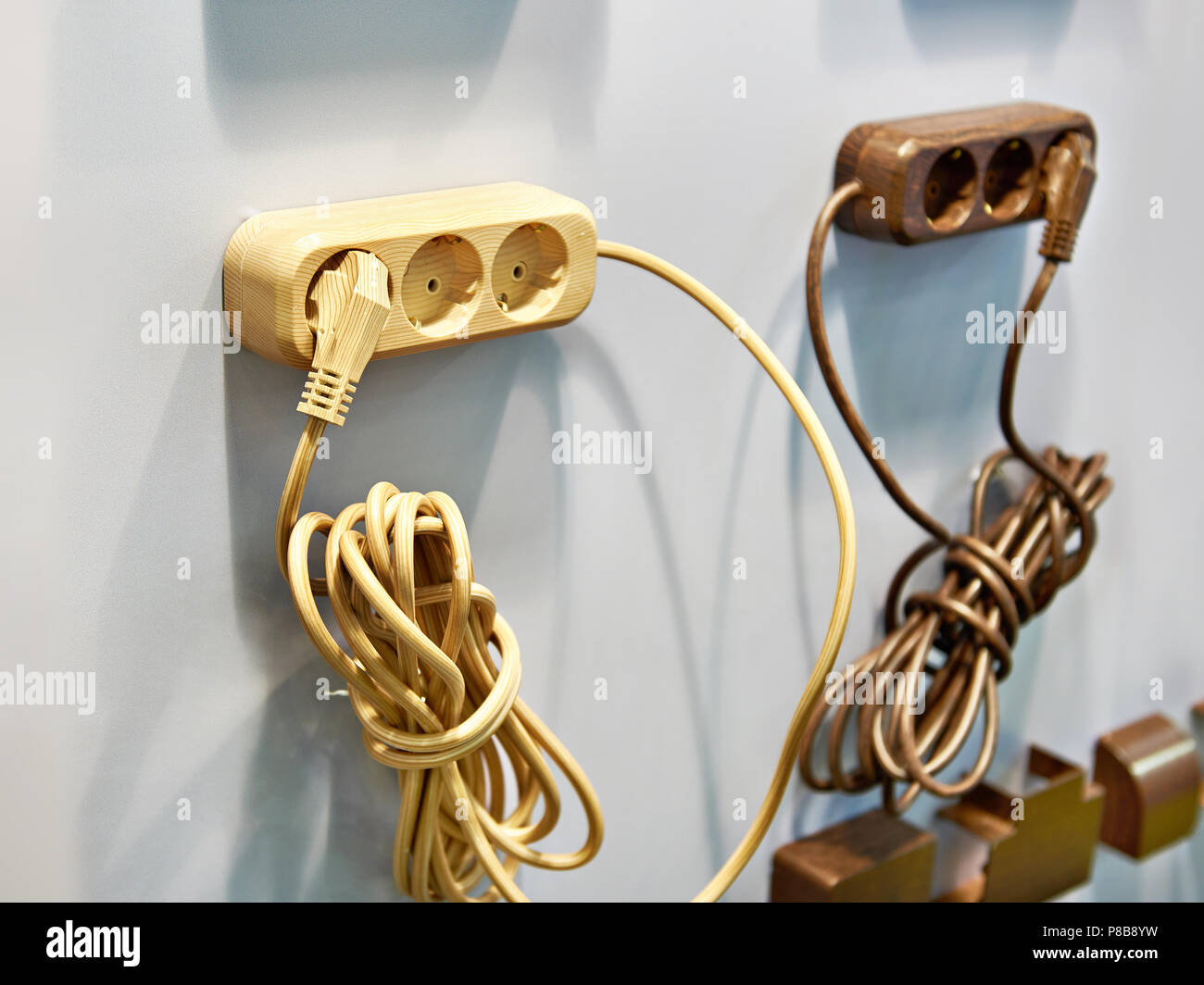 Extension cable with electrical outlets in wooden decor Stock Photo - Alamy