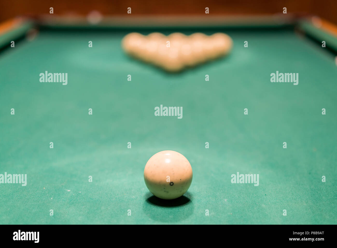 billiard table with balls and cue stick. gambling table with russian ...