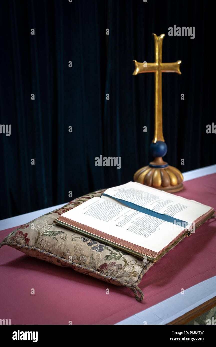 Open book and cross on alter Stock Photo - Alamy