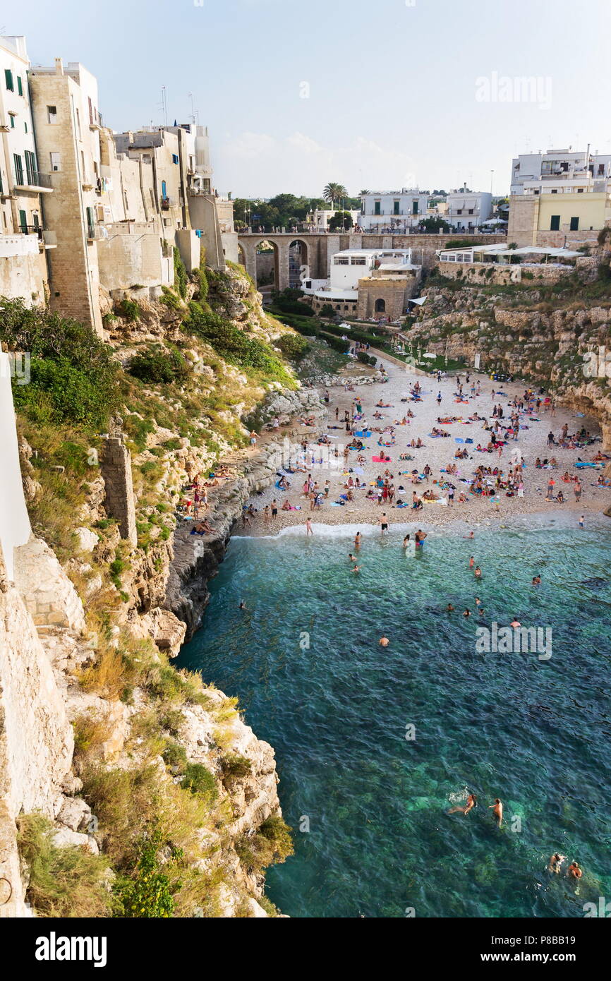 People on beach Lama Monachile in Polignano a Mare, Italy Stock Photo ...