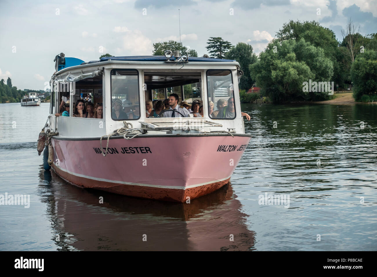 Captain and passengers on board the Walton Jester, a passenger boat on ...