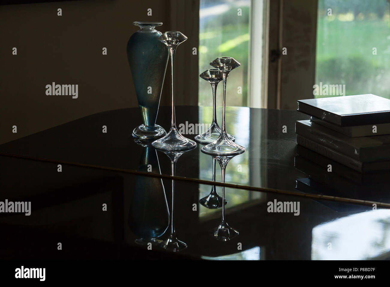 Interior with various glass objects, silhouette and reflection Stock ...