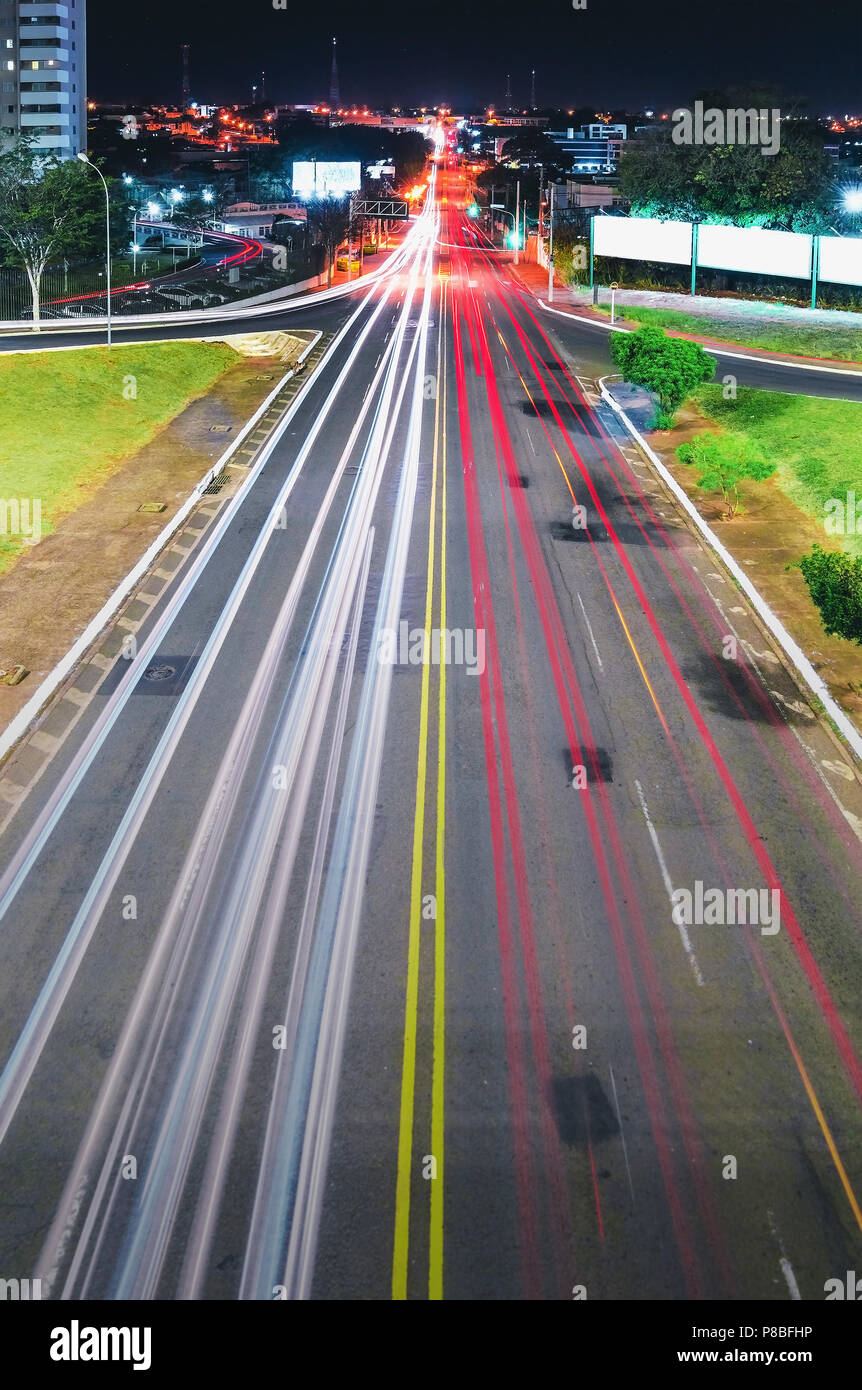 Top view of a long street, the traffic of a city at night. Traffic ...