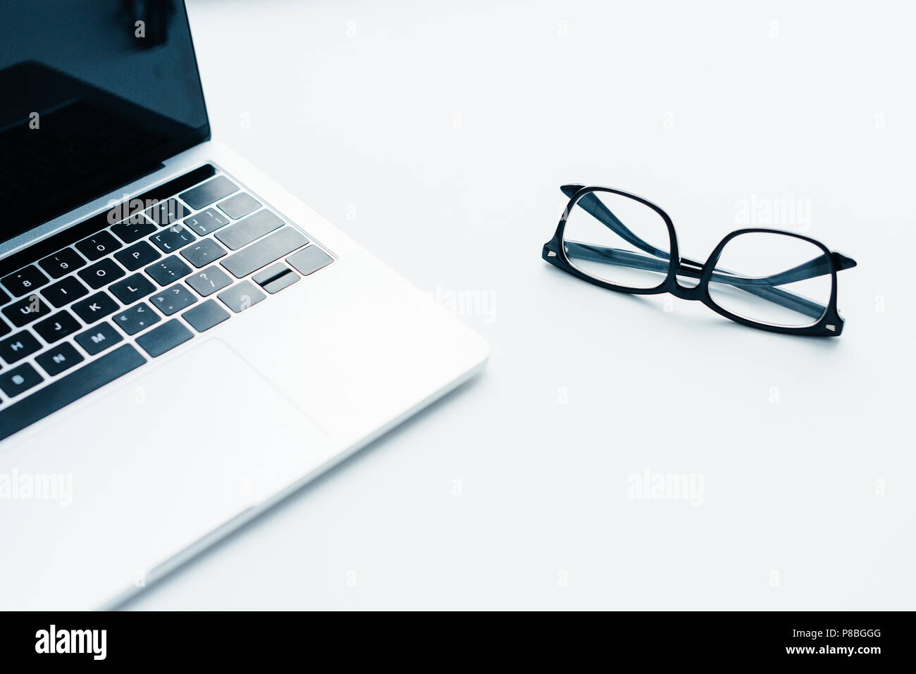 Simple workspace laptop eyeglasses hi-res stock photography and images ...
