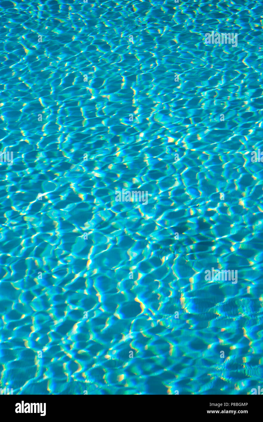 Textured light effect on the surface ripples of an outdoor swimming ...