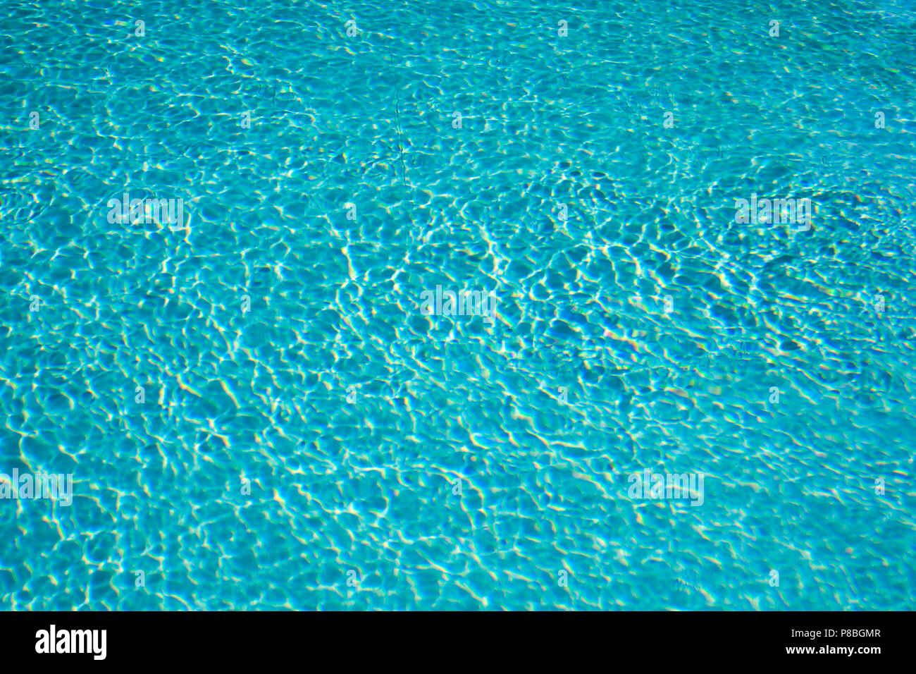 Textured light effect on the surface ripples of an outdoor swimming ...