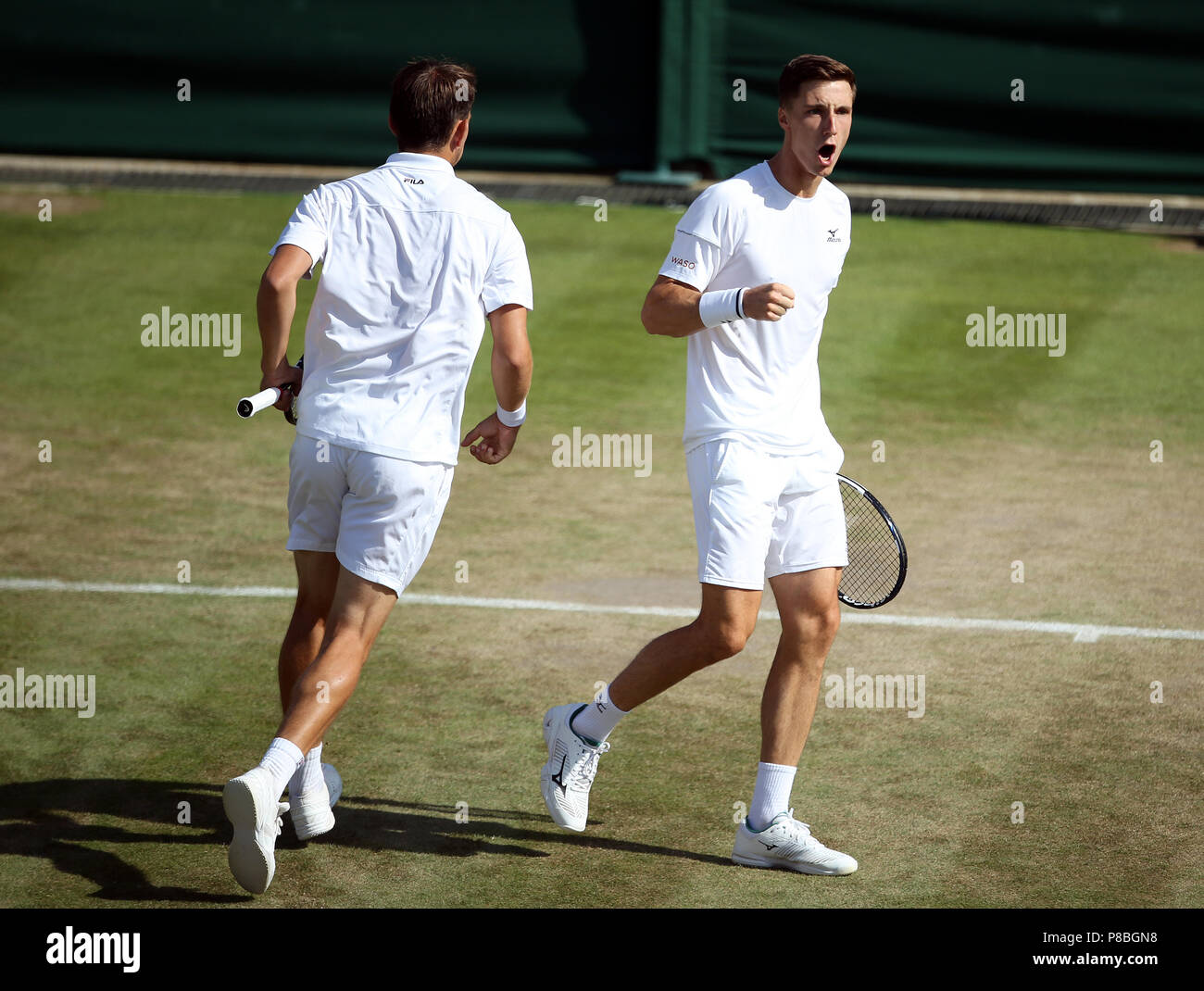 Joe Salisbury (right) and Frederik Nielsen during their doubles match ...