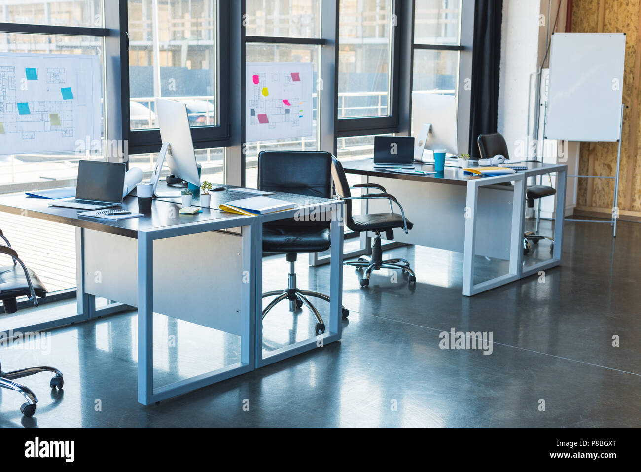 working tables with computers and laptops in business office Stock ...