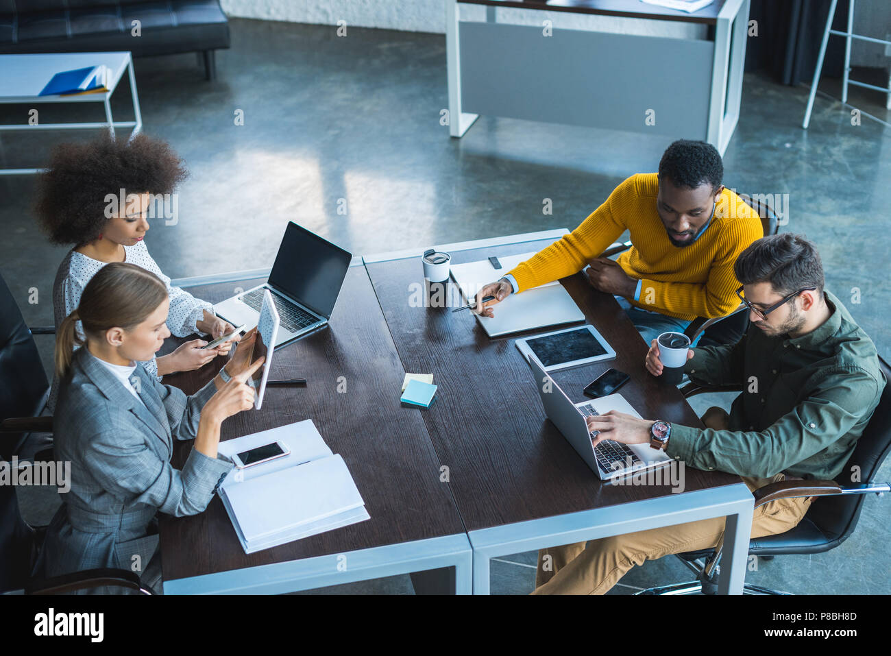 Using digital tablets laptops business hi-res stock photography and ...