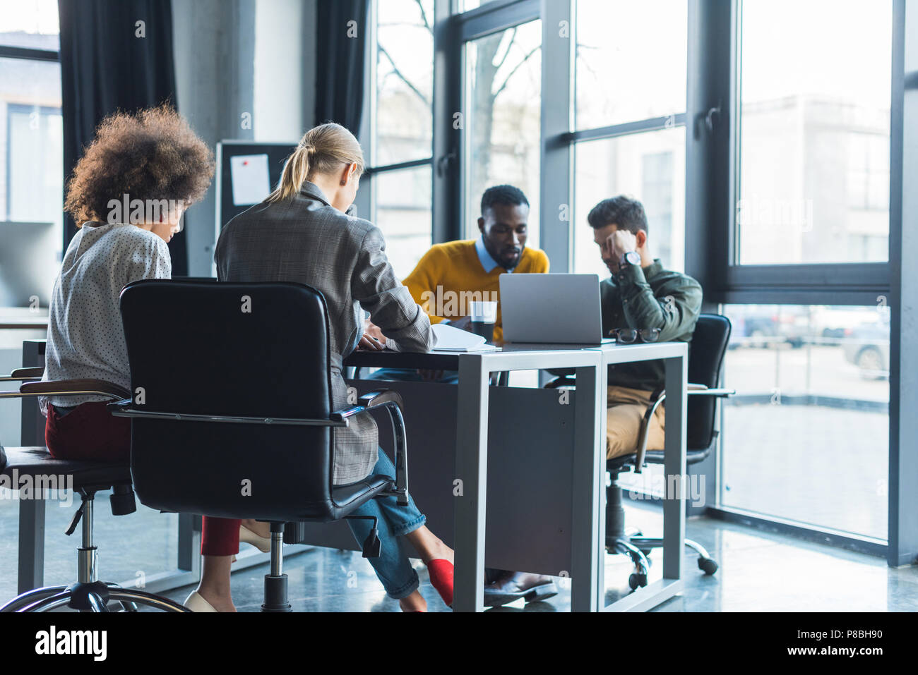pensive multicultural businesspeople at meeting in office Stock Photo ...