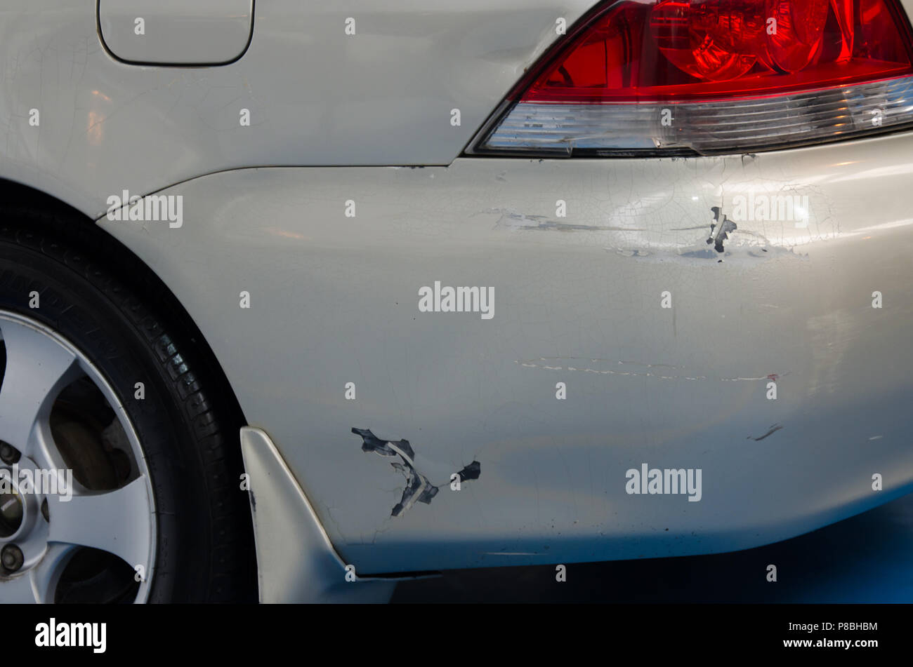 Rear bumper accident damaged car Stock Photo - Alamy