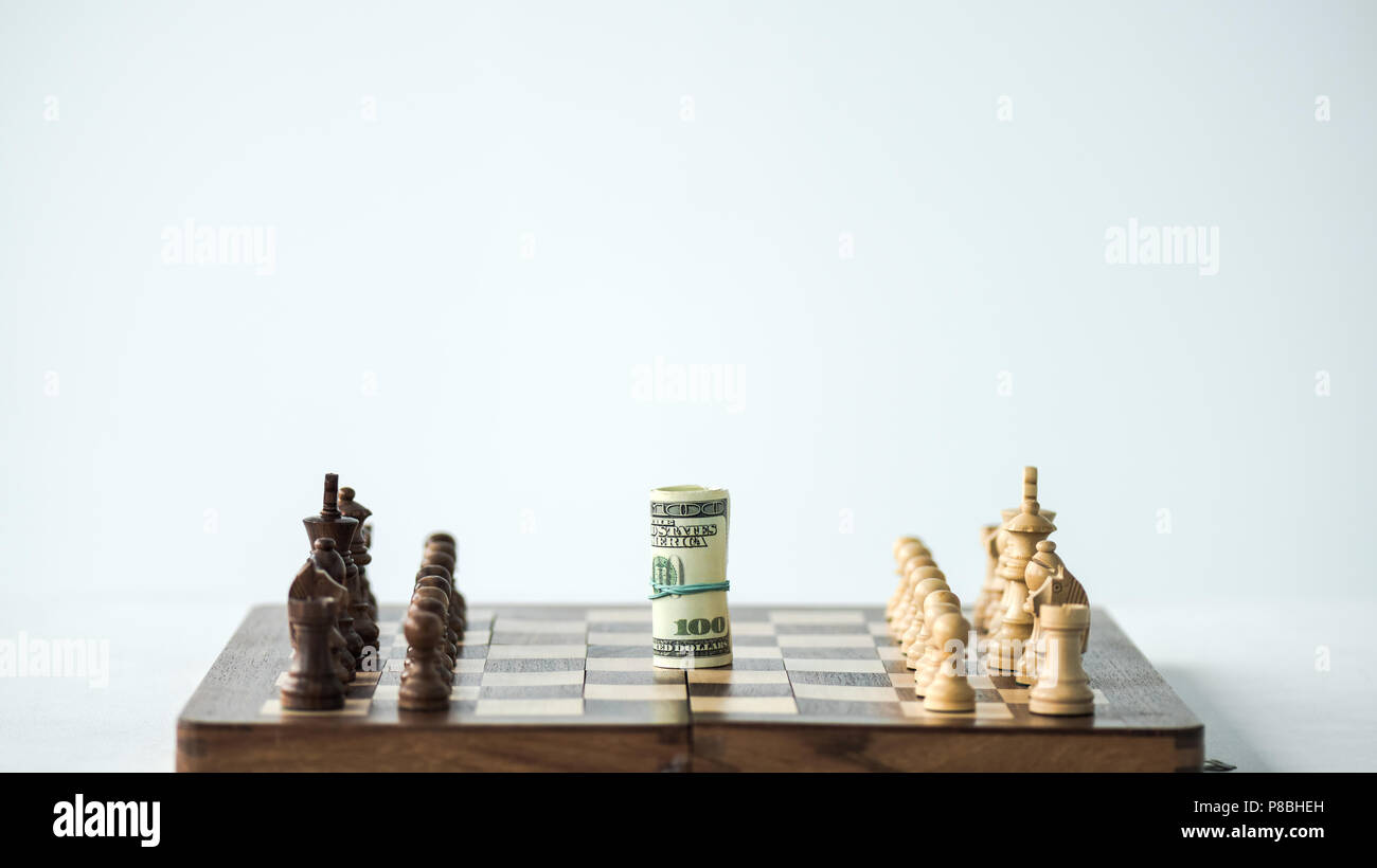 Chess board with cash and chess pieces isolated on white Stock Photo ...