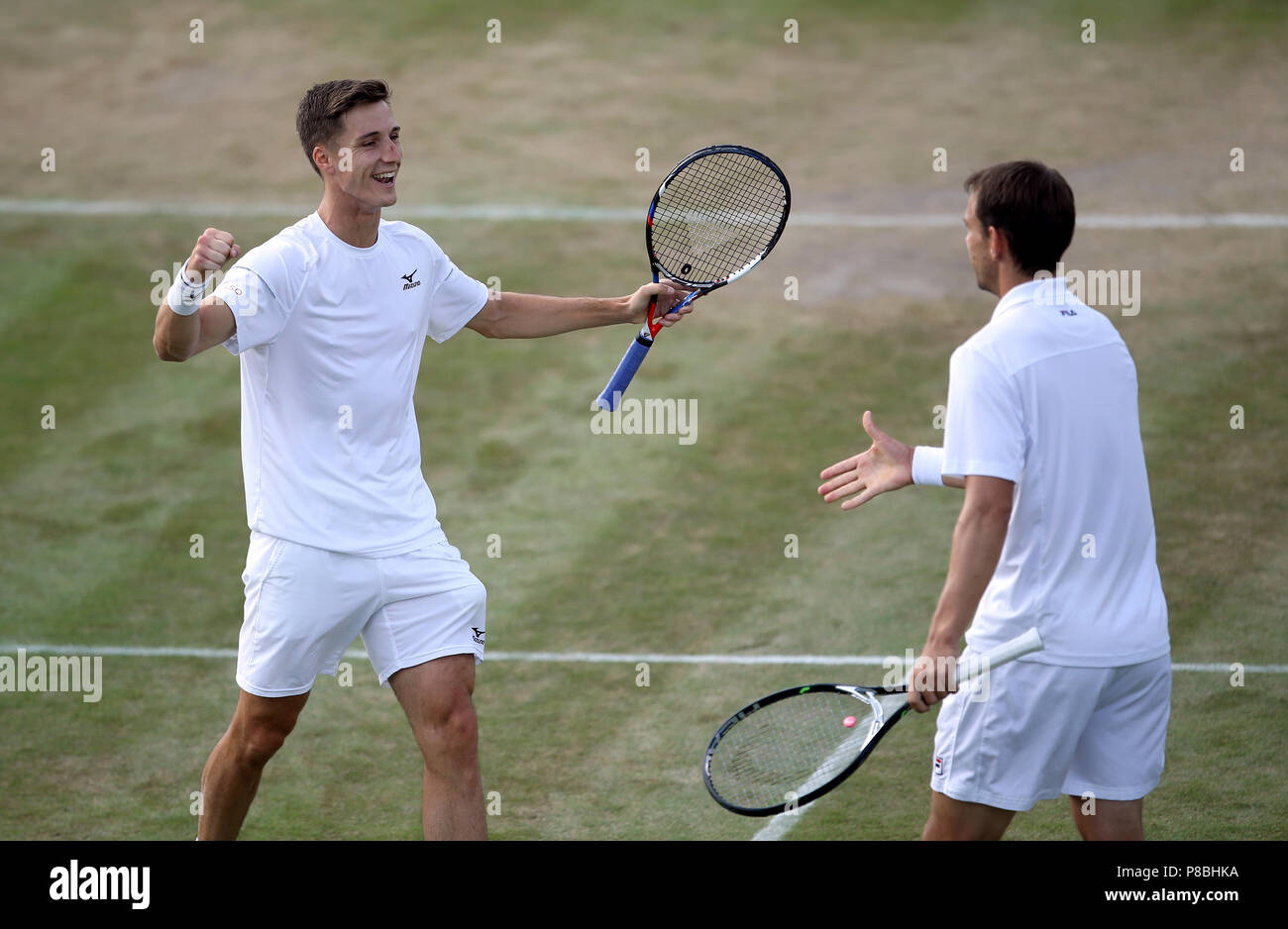 Joe Salisbury (left) and Frederik Nielsen celebrate winning their ...