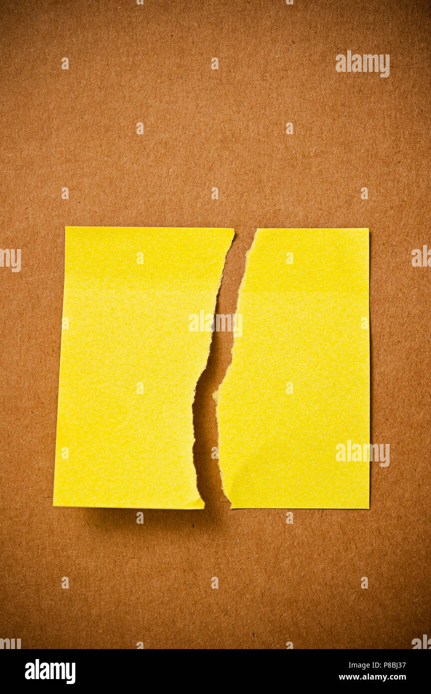 yellow post-it ripped in half Stock Photo - Alamy