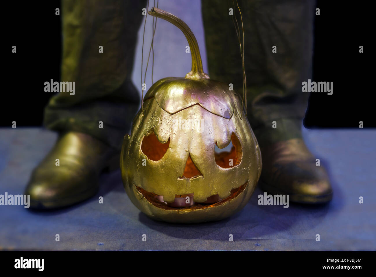 golden pumpkin with ropes standing on the floor, background image Stock ...