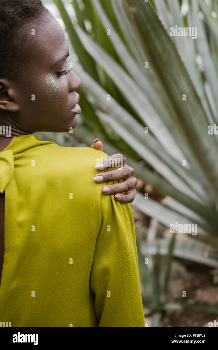 back view of beautiful stylish african american girl with glitter ...