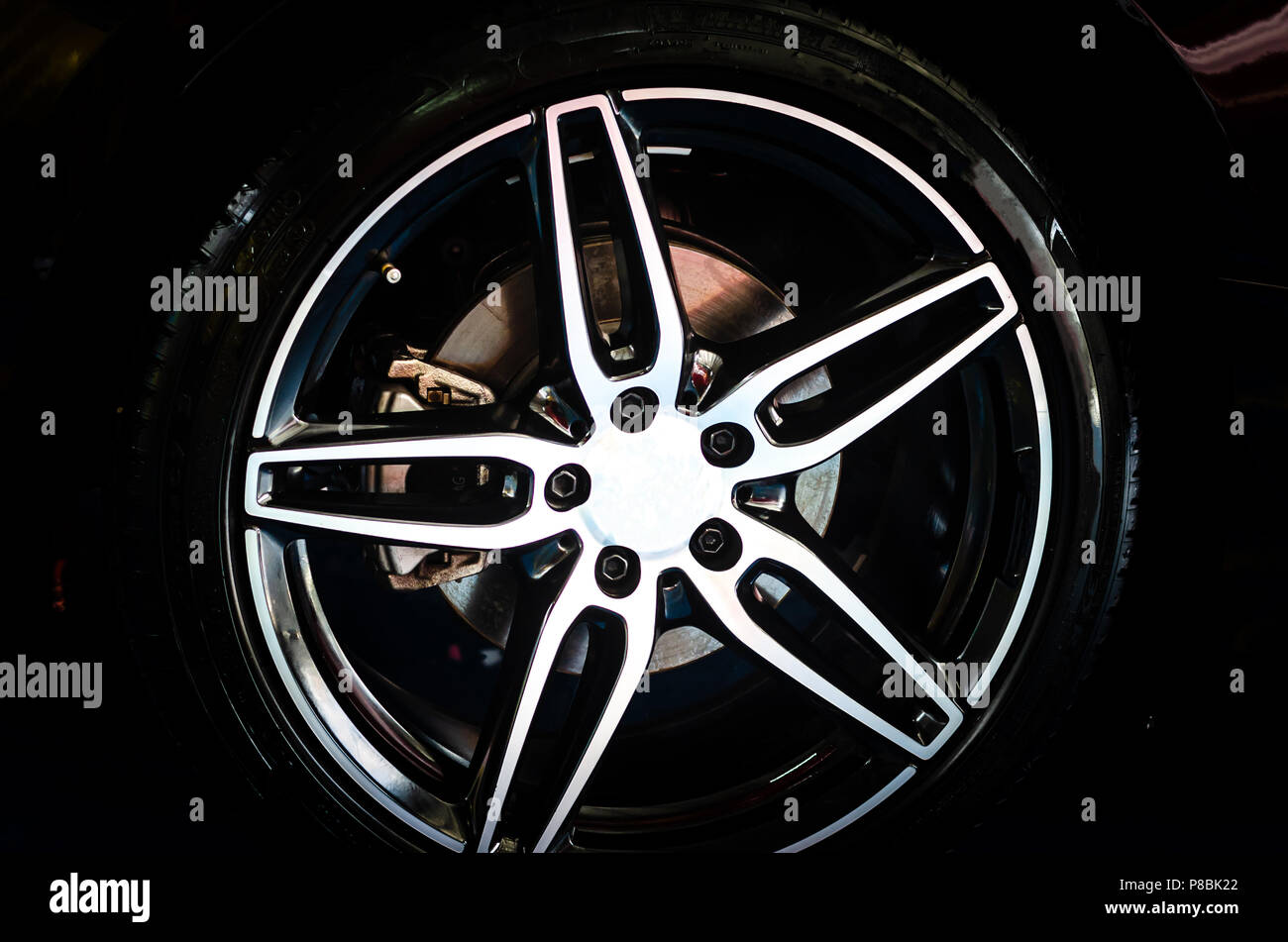 Luxury alloy wheel in close-up as an automotive Stock Photo - Alamy