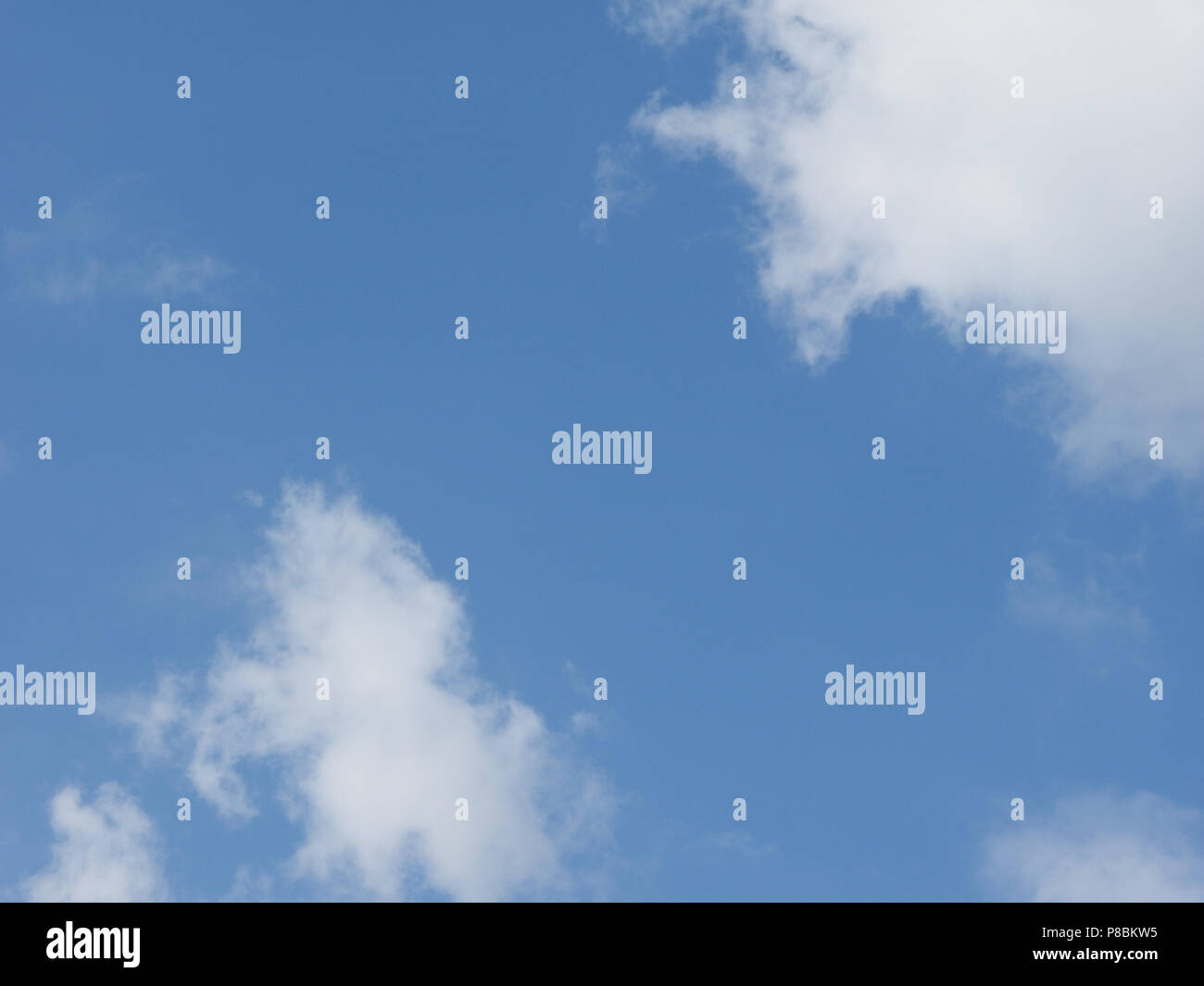 blue sky with clouds useful as a background Stock Photo - Alamy