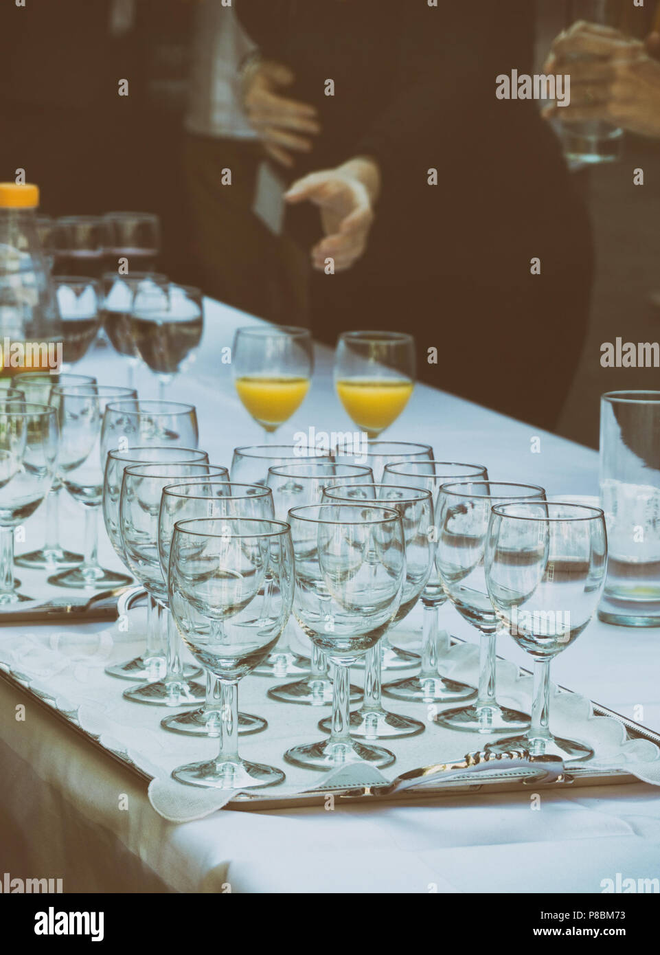 Table served with glasses for a buffet table Stock Photo - Alamy