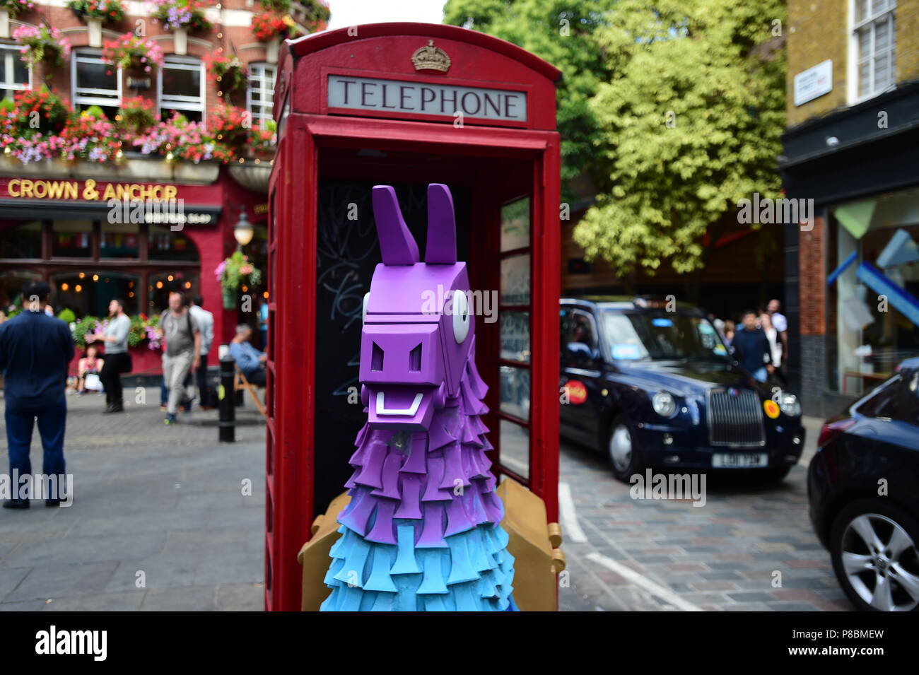 A Fortnite Loot Llama in a red telephone box on Neal Street in Covent ...