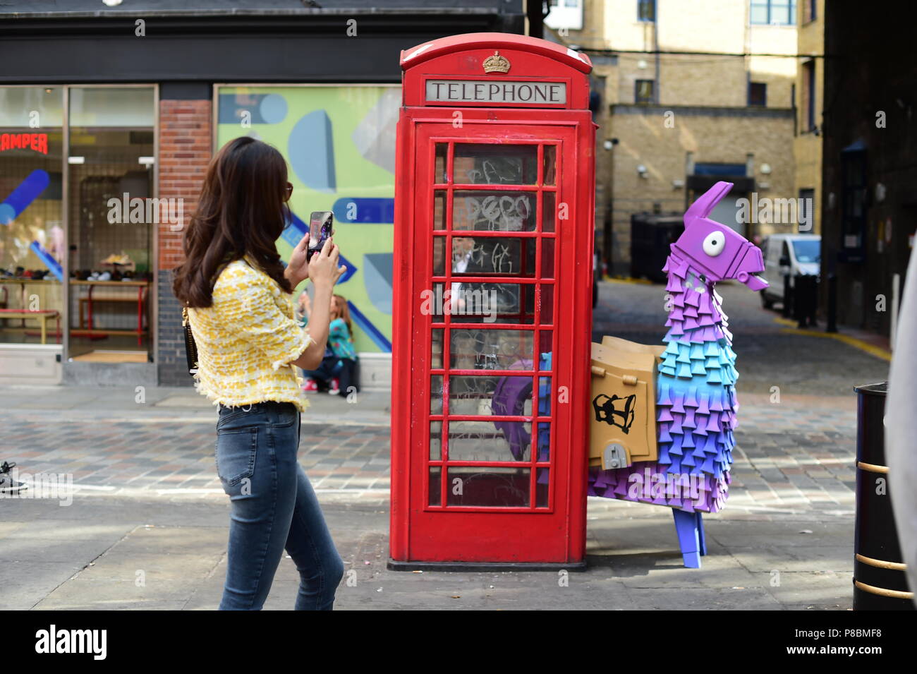 A Fortnite Loot Llama in a red telephone box on Neal Street in Covent ...