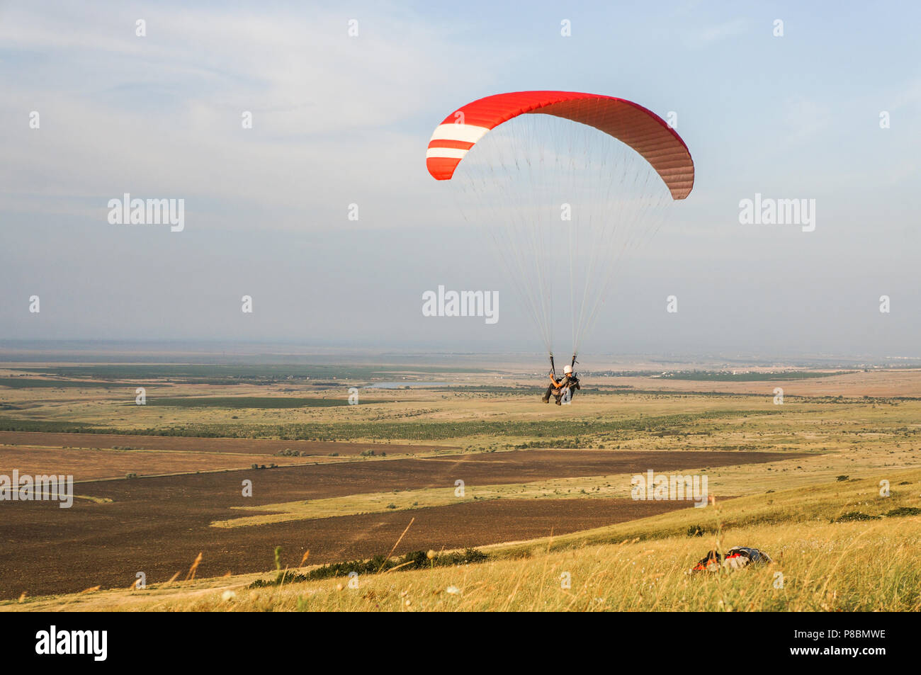 person flying on paraplane sky with clouds on background Stock Photo ...