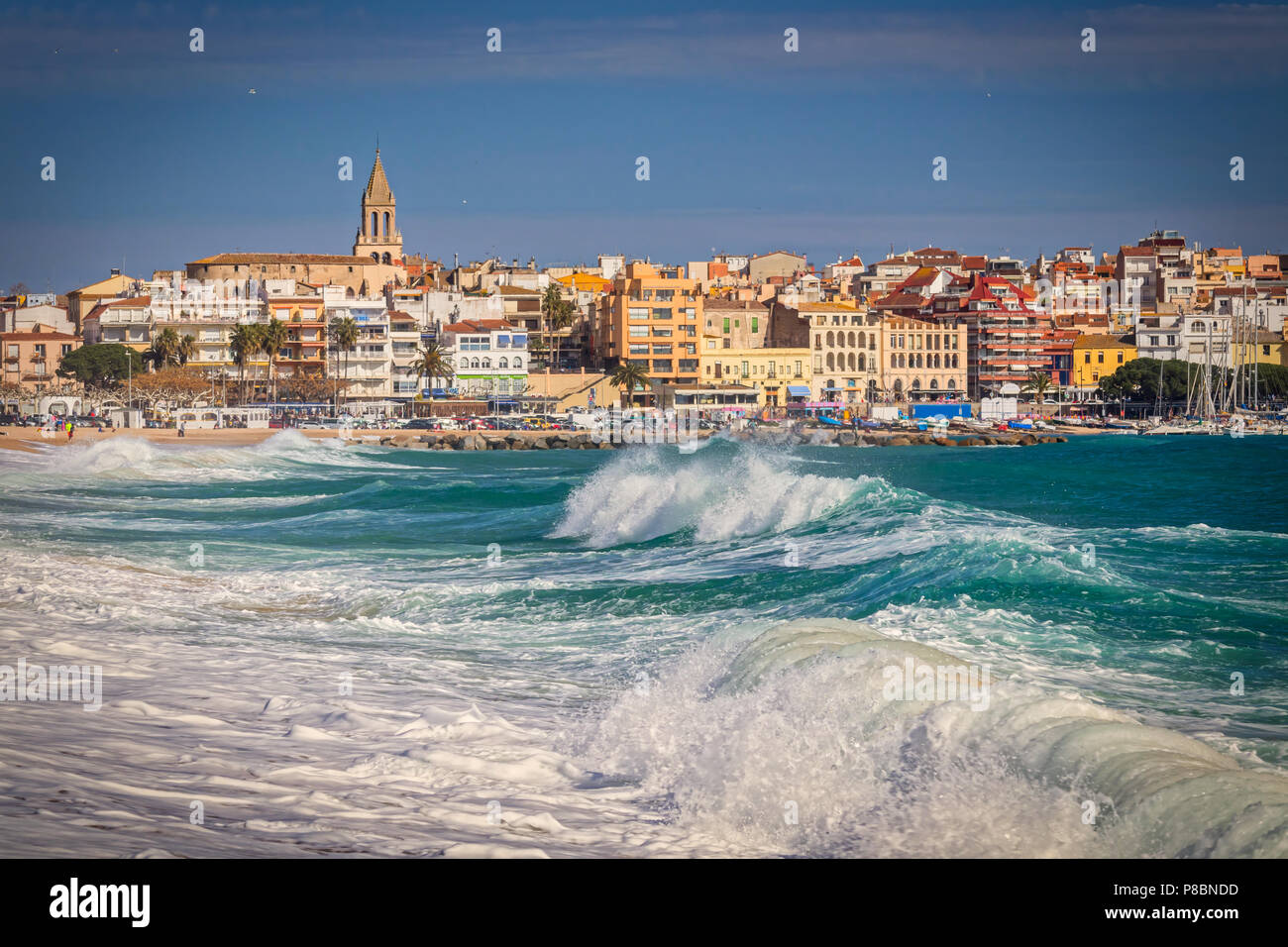 Beautiful Spanish village Palamos in Costa Brava with big waves Stock ...