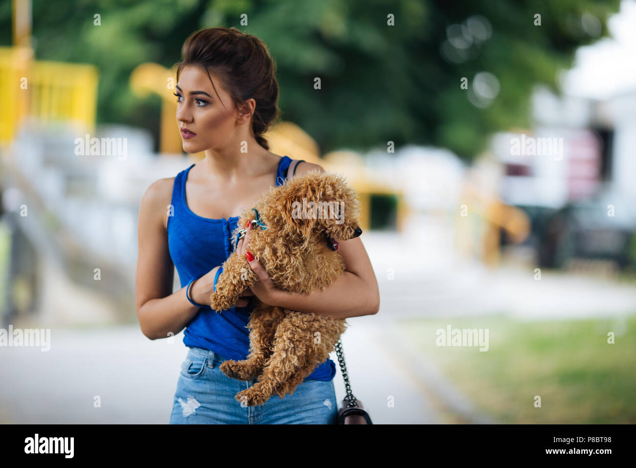 Woman Holding Poodle High Resolution Stock Photography and Images - Alamy