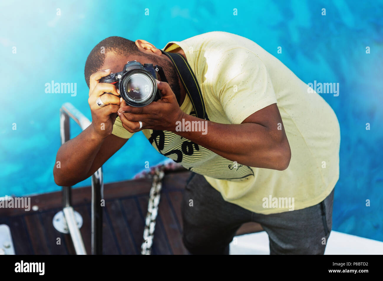 Man is a professional photographer with camera outdoor Stock Photo - Alamy