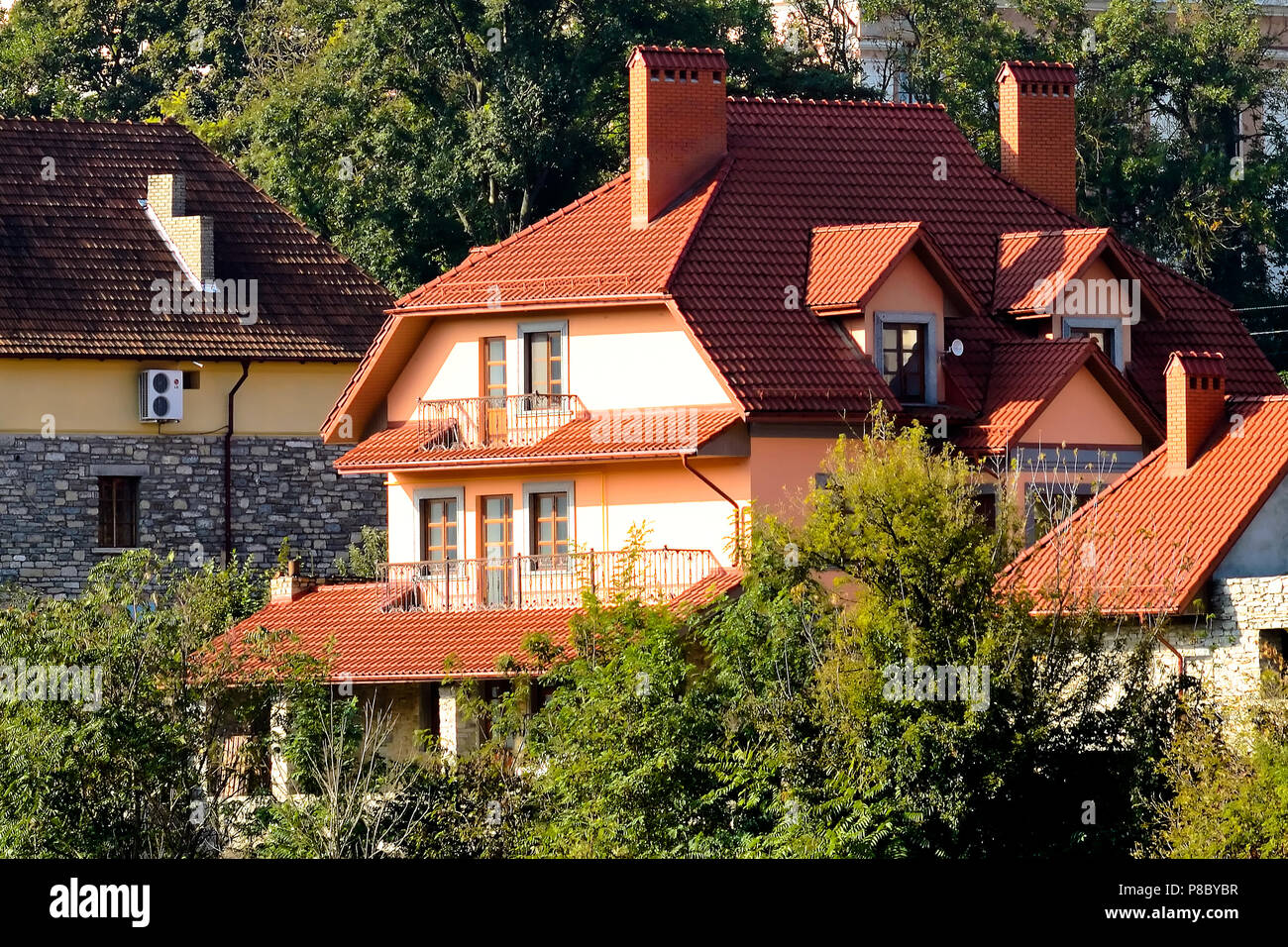 Two-storey cottage with an attic and a red roof Stock Photo - Alamy