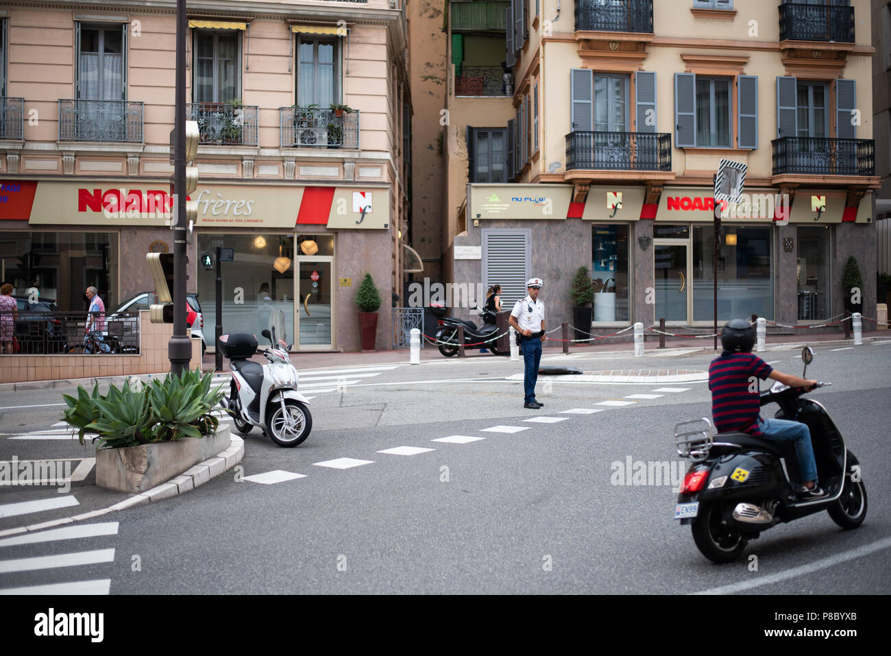 Policeman directing traffic in Monaco Stock Photo - Alamy