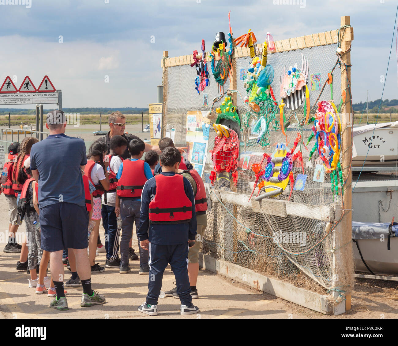 Group of school children on a day trip to Mersea Island, about to go ...