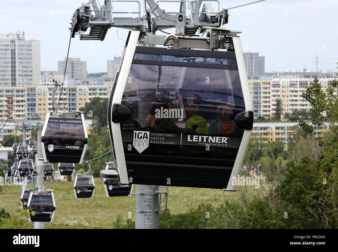 Berlin, Germany, gondolas of the cable car over the gardens of the ...