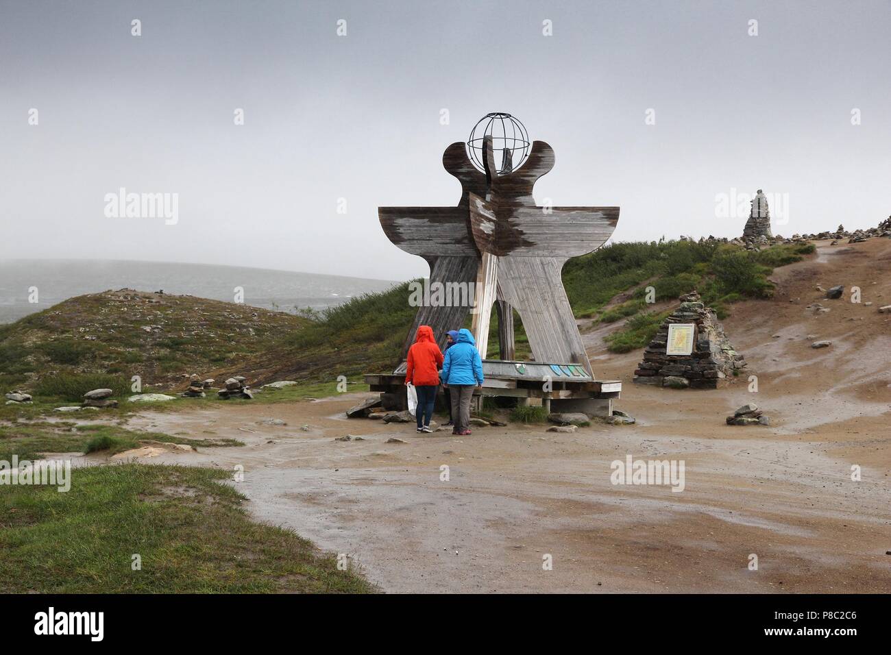 ARCTIC CIRCLE, NORWAY - JULY 30, 2015: People visit statue at Arctic ...