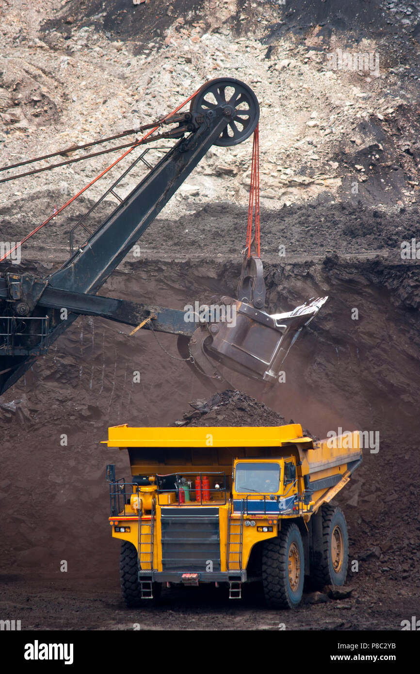 big mining truck unload coal Stock Photo - Alamy