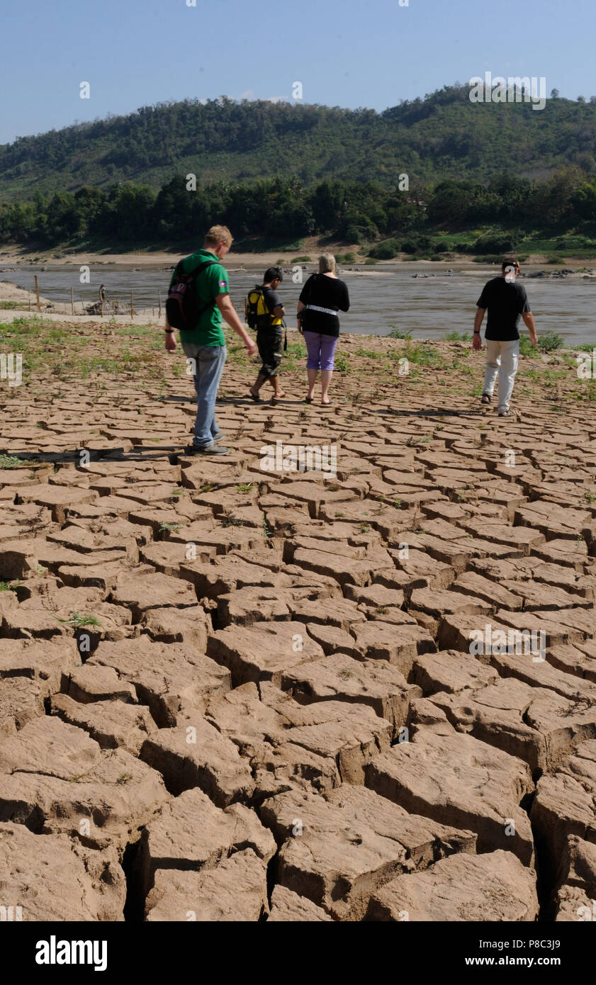 Mekong Sun cruise guests are walking over dry earth at the Mekong River ...