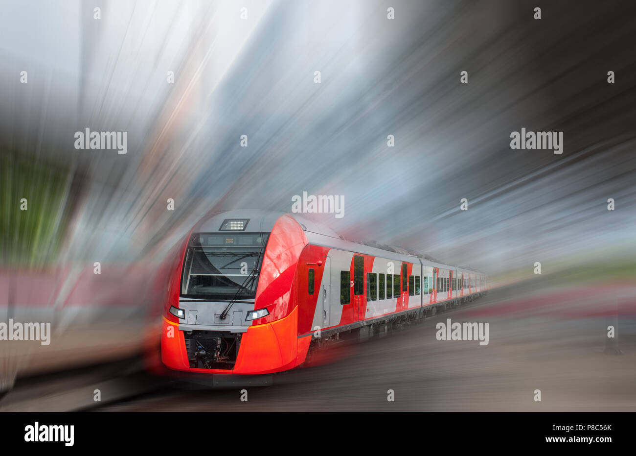 The electric train rushes at a high speed Stock Photo - Alamy