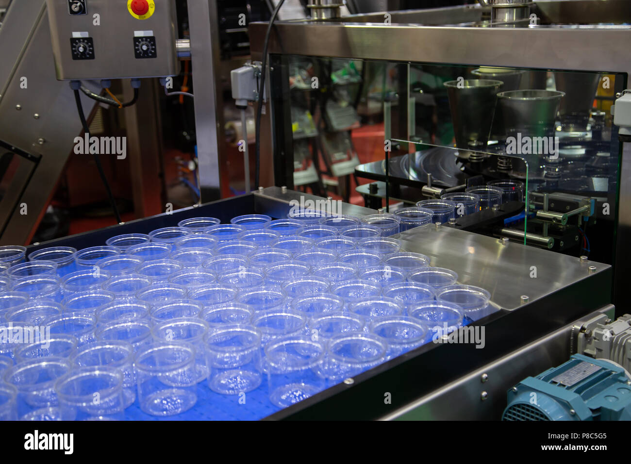 Production line of liquid filling and packing plastic cup machine Stock ...