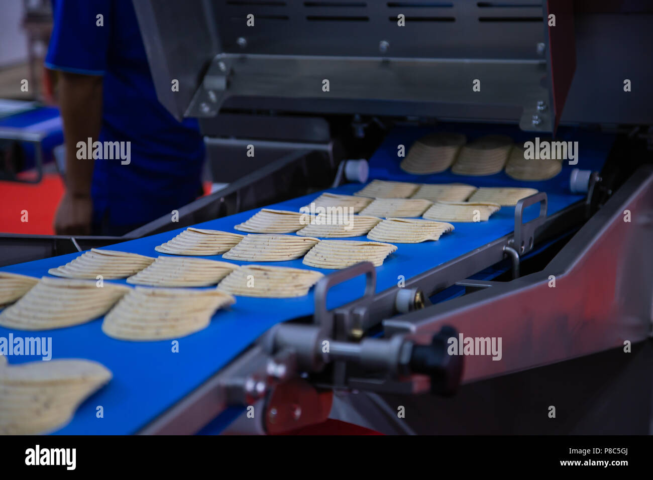 Production line of meat slicer machine Stock Photo - Alamy