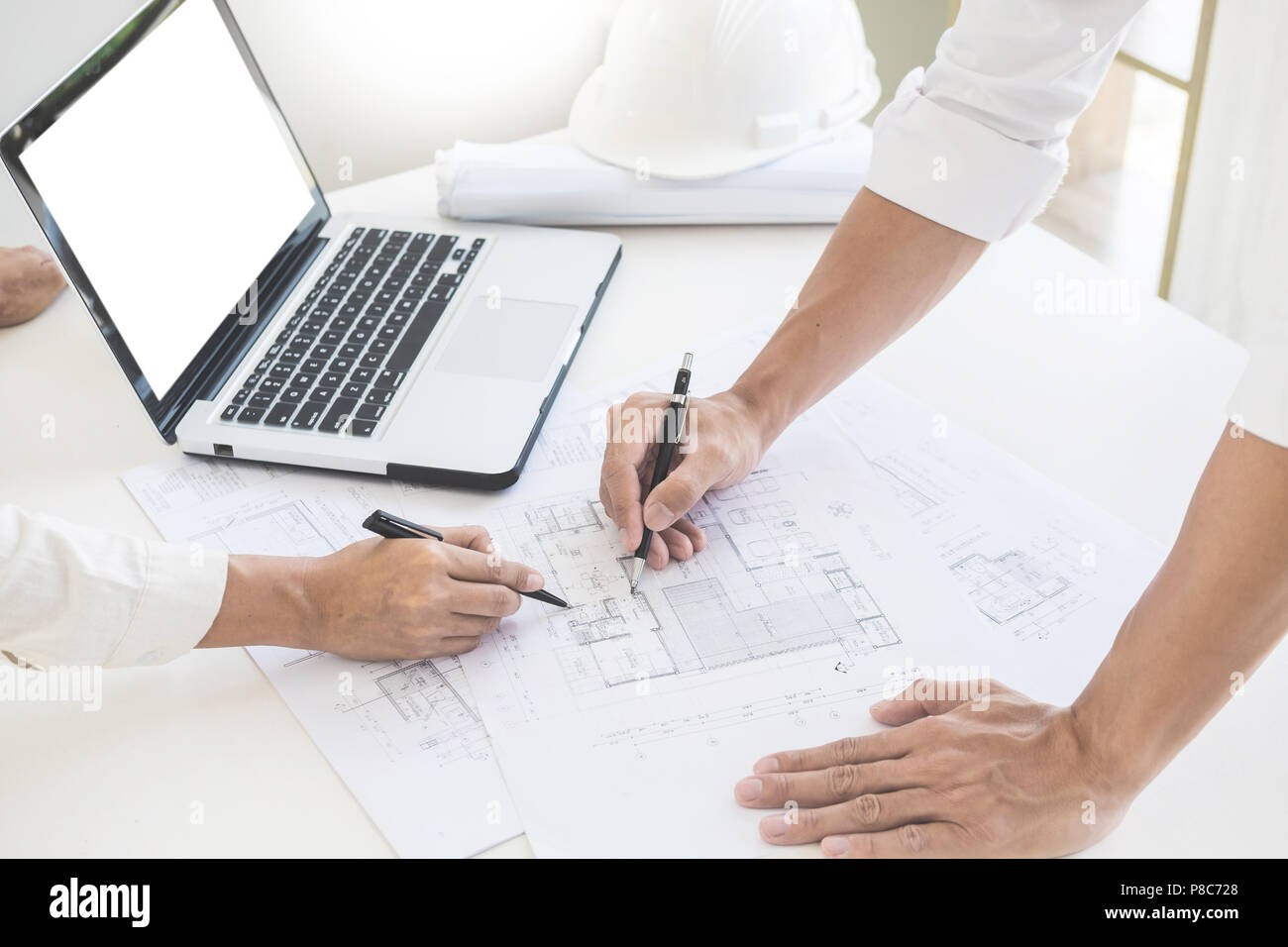 Close-up Of Person's engineer Hand Drawing Plan On Blue Print with ...
