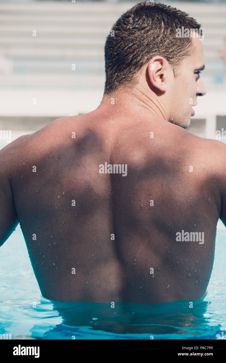 Handsome young man in the swimming pool Stock Photo - Alamy