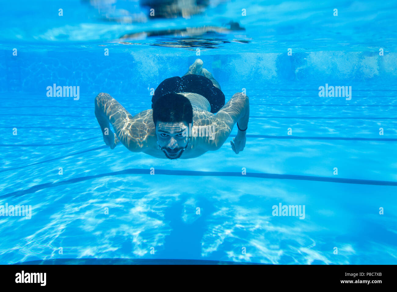 Man diving in pool hi-res stock photography and images - Alamy