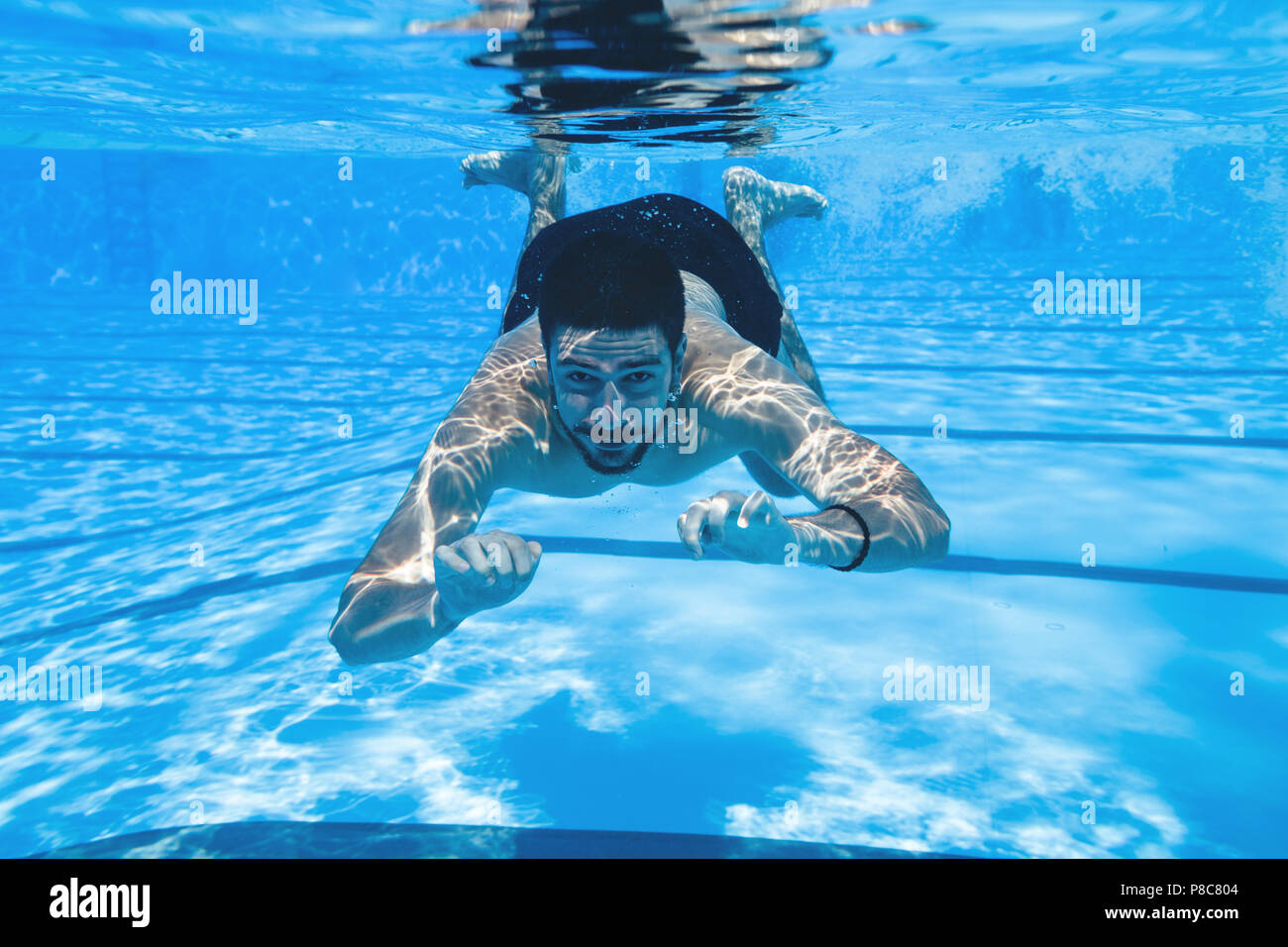 Man Swimming Underwater Up