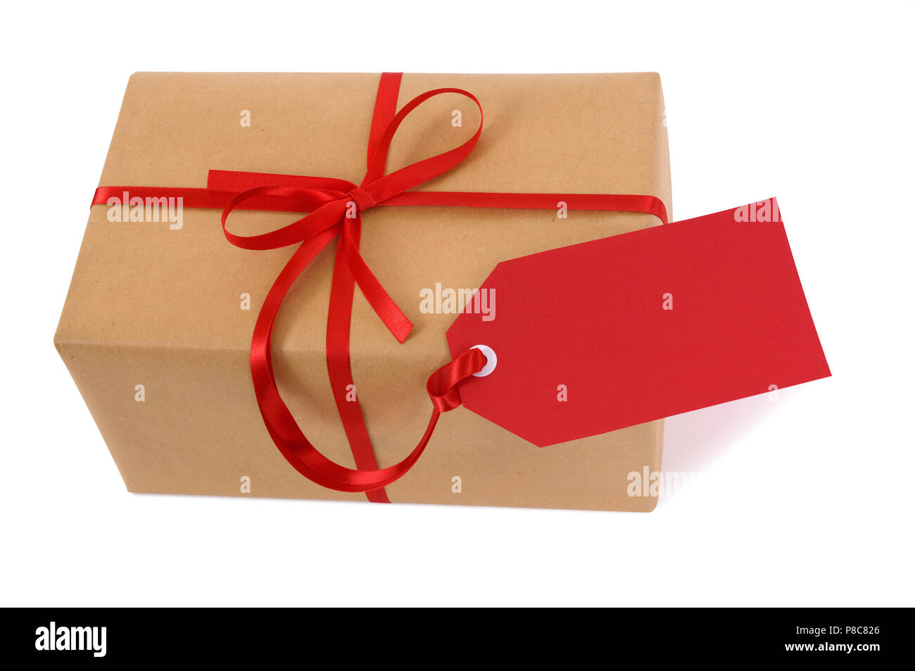 Brown paper package or gift tied with red ribbon and gift tag isolated ...