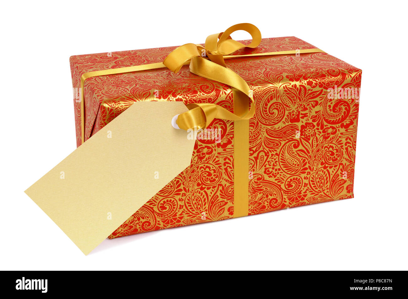 Red and gold gift with ribbon and gift tag label isolated on white ...