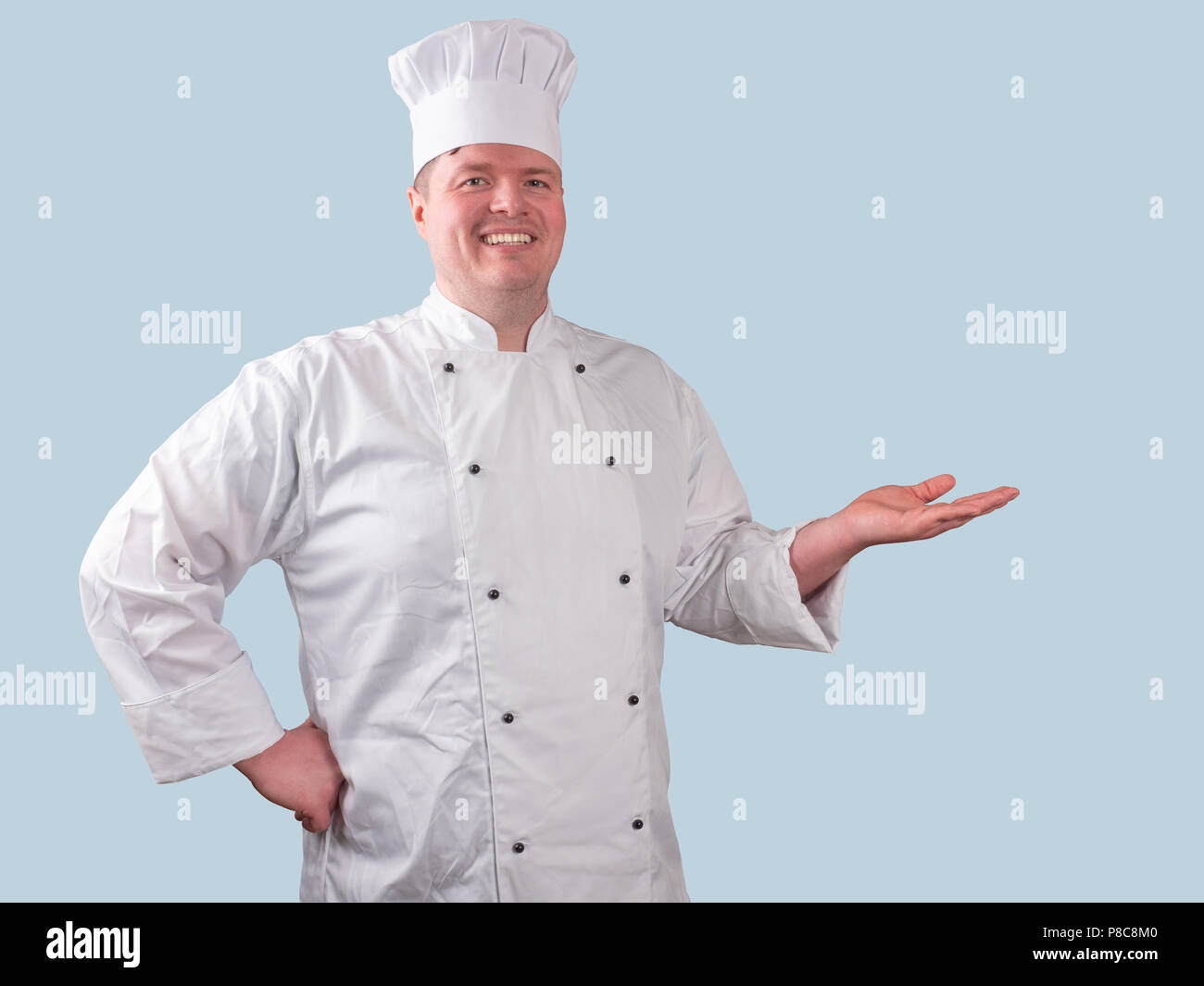 Chef presents something Stock Photo - Alamy