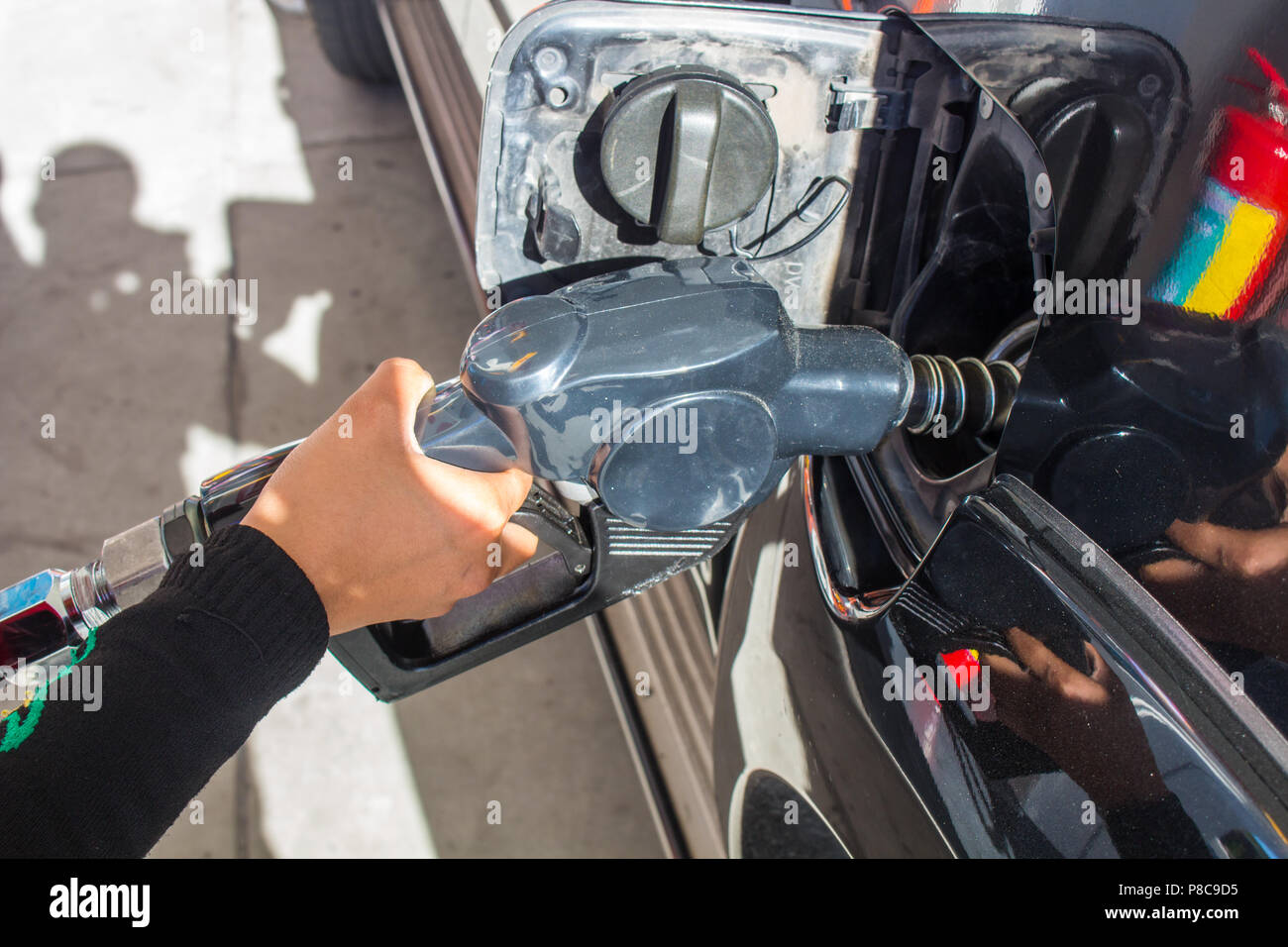 The hand refueling to vehicle Stock Photo - Alamy