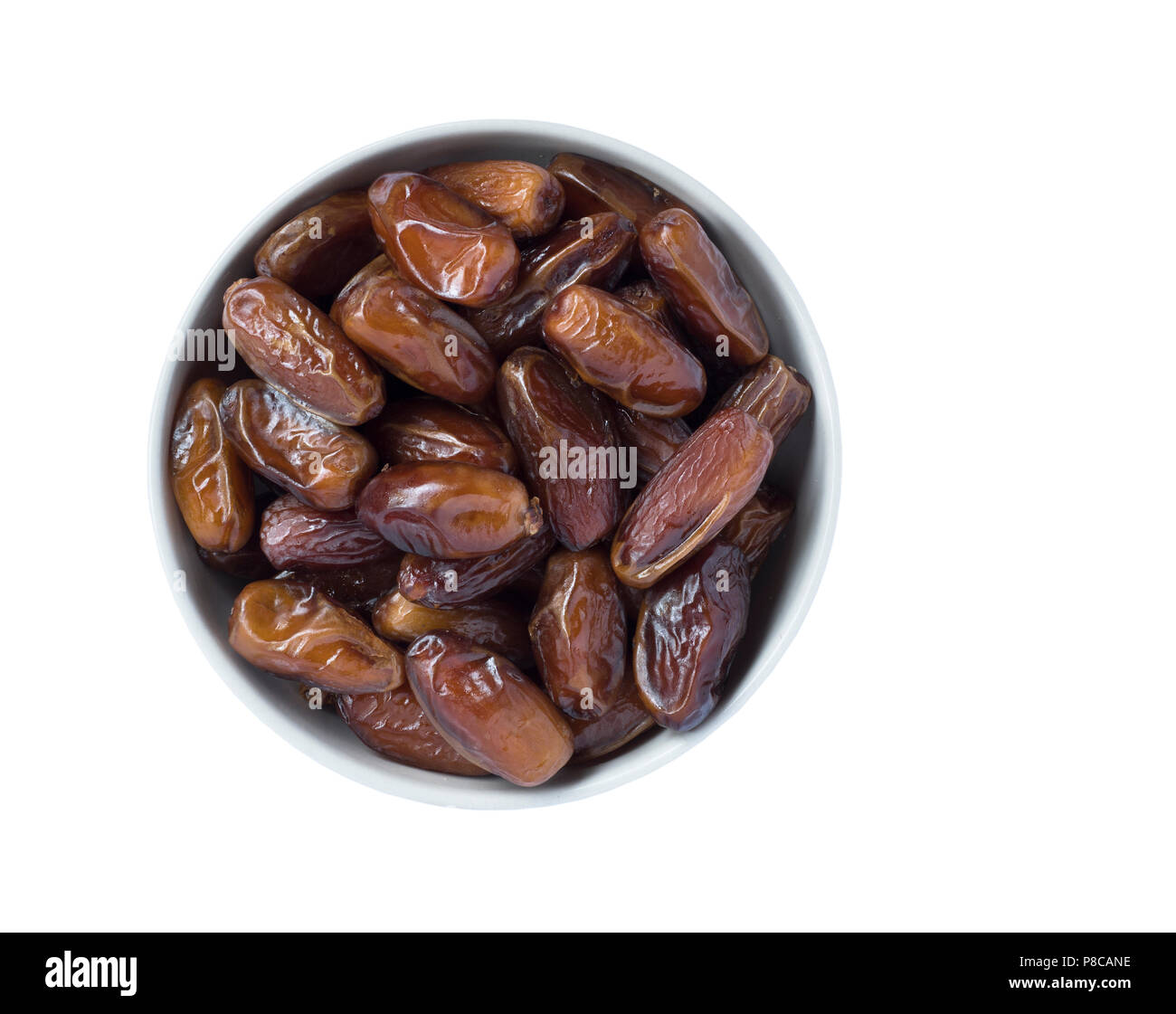 Full bowl of dried dates isolated on white background. Top view Stock ...
