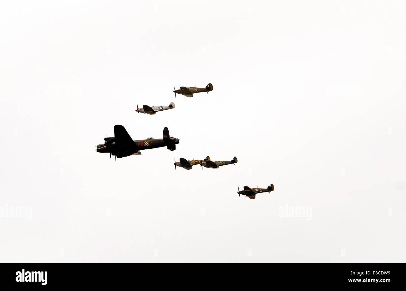 Lancaster, Hurricane and Spitfire Aircraft fly in formation over the ...