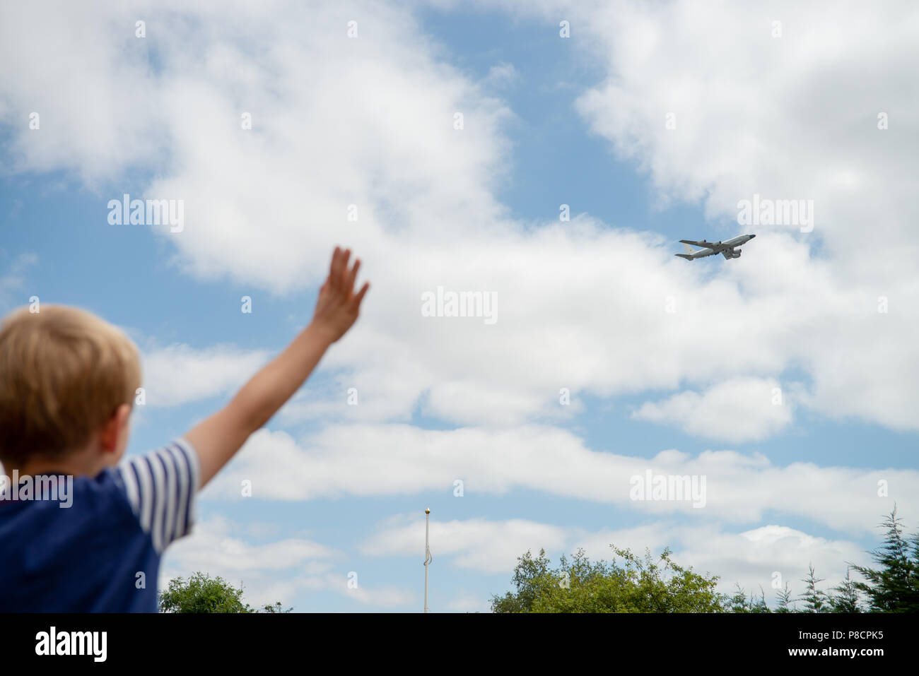 Kids waving at planes RAF 100 Fly by Stock Photo - Alamy